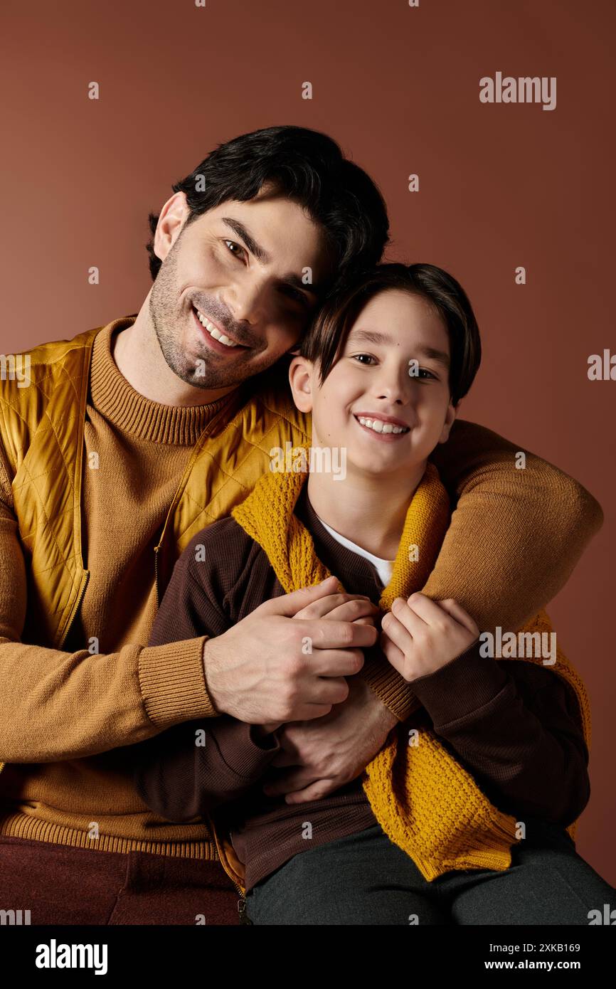 A father and son share a loving embrace, radiating warmth and happiness ...