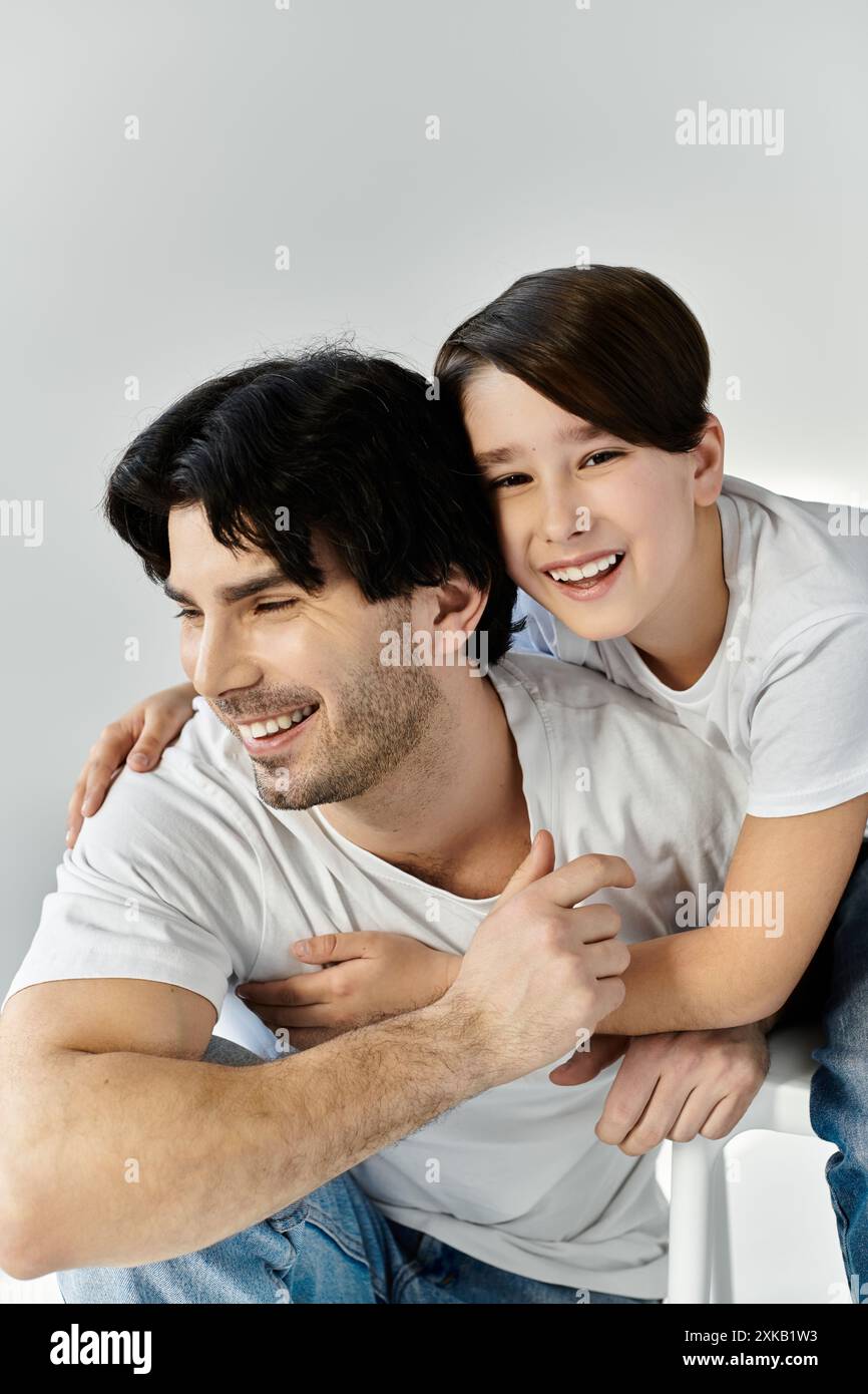 A father and his son share a moment of joy and affection Stock Photo ...