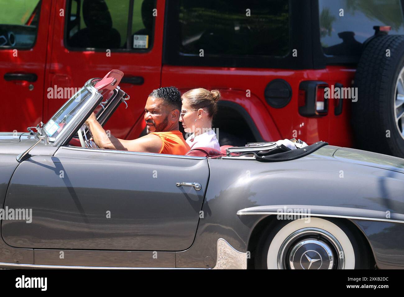 Jennifer Lopez and her manager Benny Medina leave the gym in style in a ...