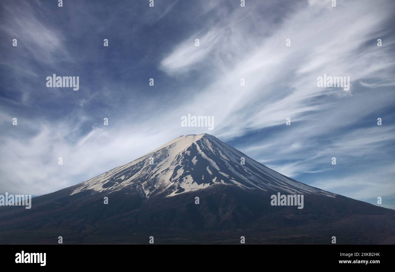 Mount Fuji in the sky background with dark clouds and strong winds like ...