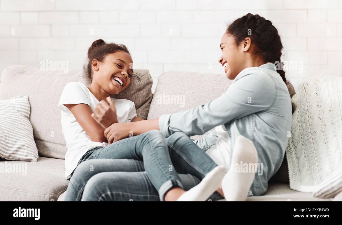 Cute black sisters having fun together at home Stock Photo - Alamy