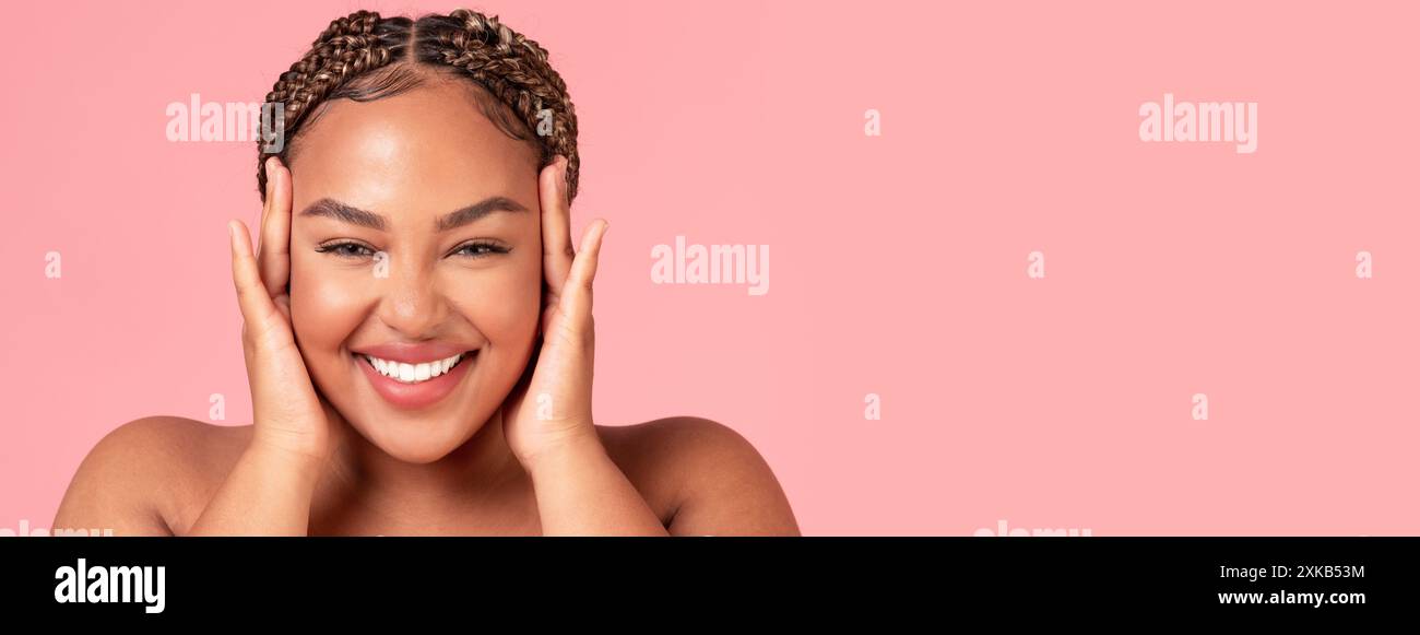 Portrait of happy beautiful african american woman touching her face ...