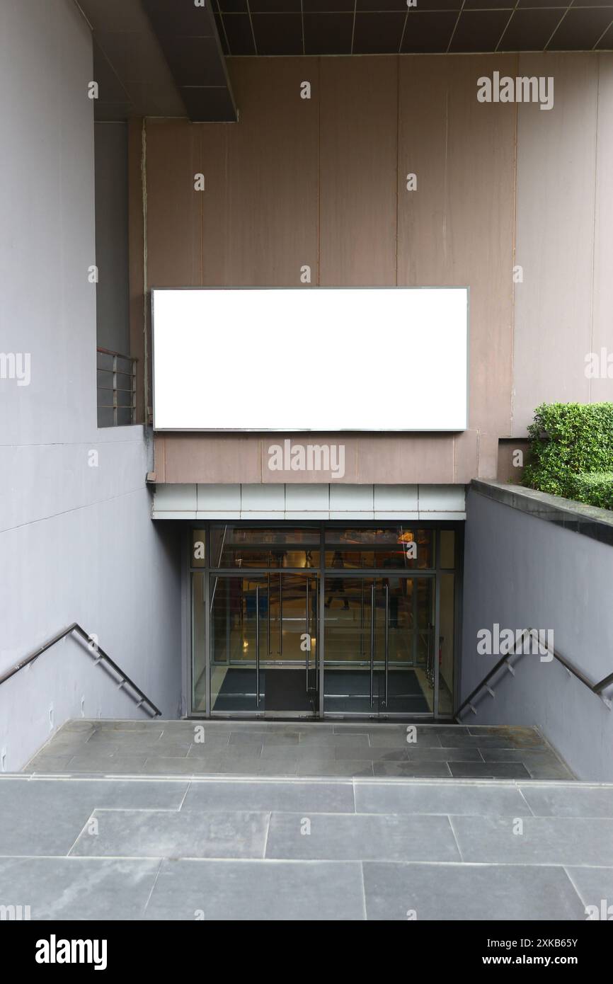 Blank billboard stuck on the wall of a shopping mall, Blank sign for ...