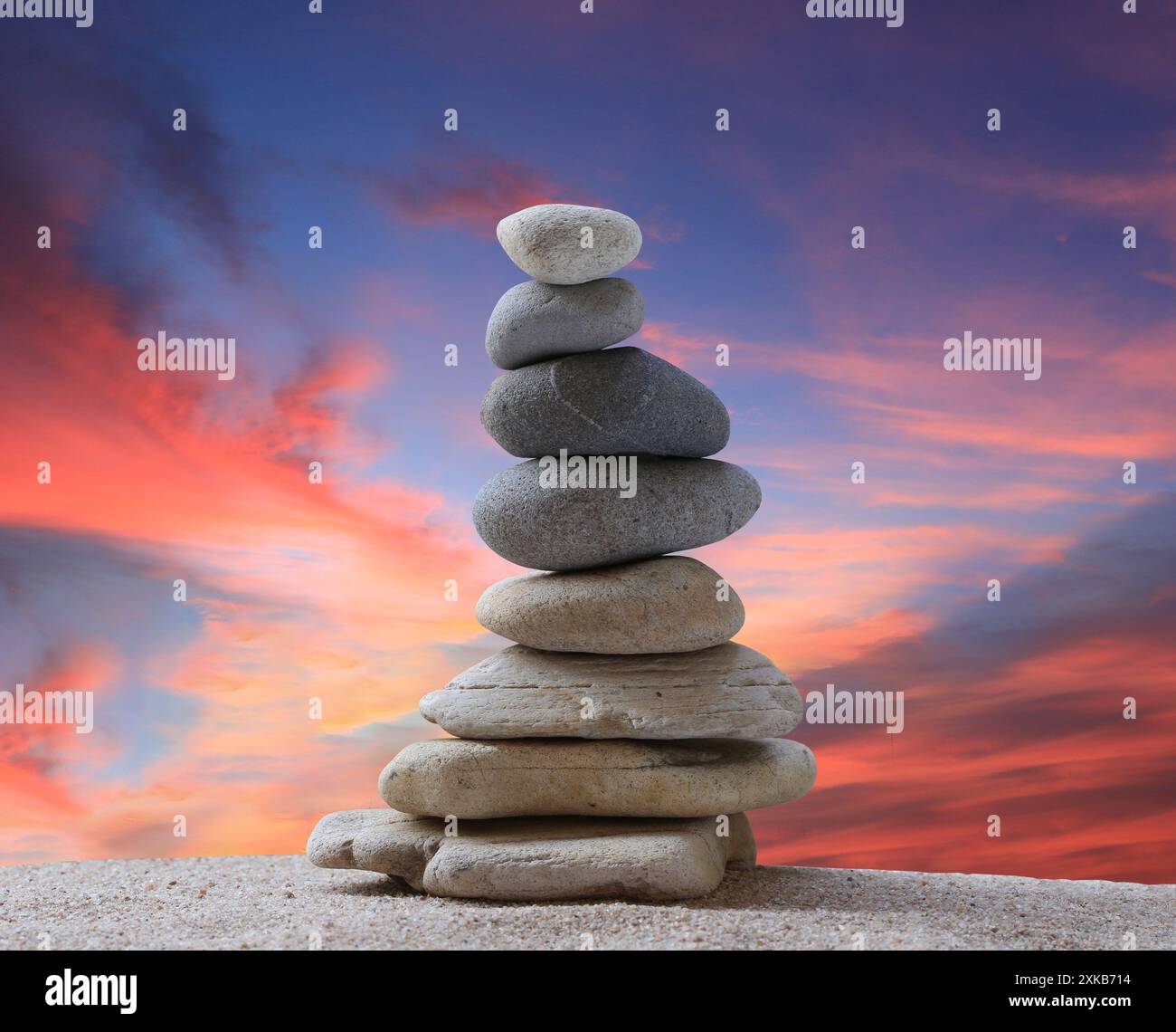Stacked stones in a pyramid shape on a background on sunset and copy ...
