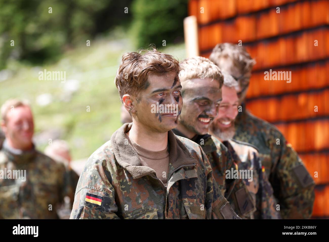 Schneizlreuth, Germany. 22nd July, 2024. Mountain soldiers queue up for ...