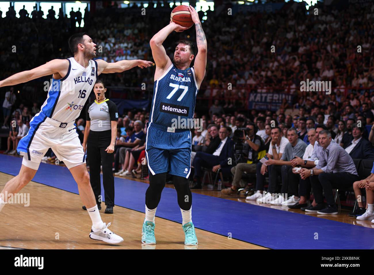 Luka Doncic (Slovenia) shooting over Dimitris Moraitis (Greece). FIBA ...