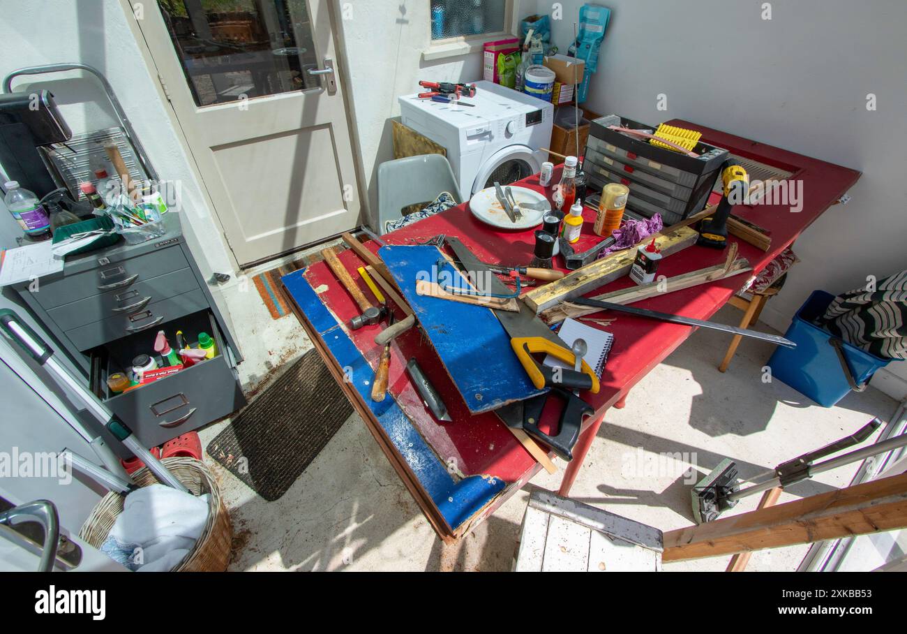 Improvised table top to eat breakfast on adark red door being repaired ...