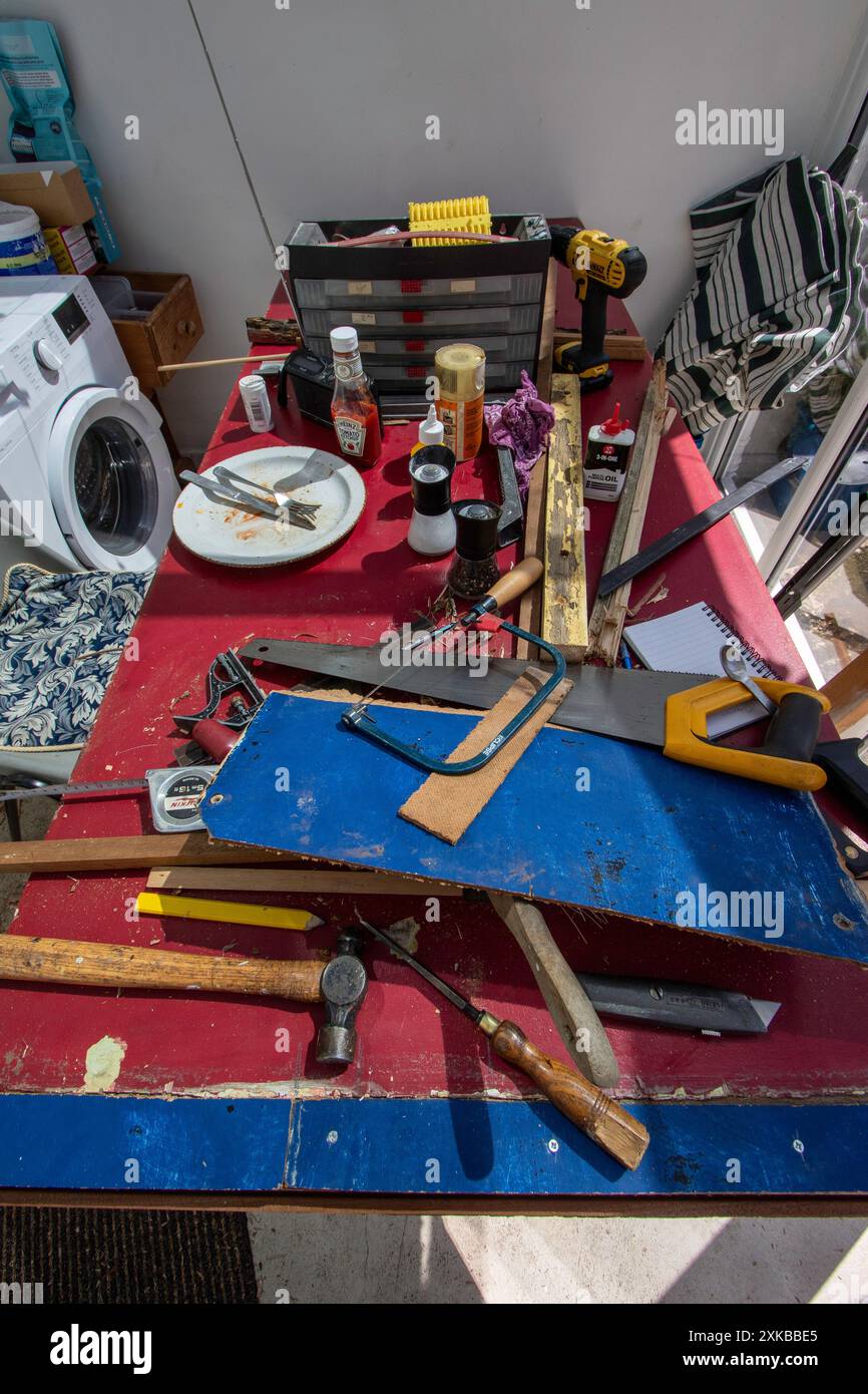 Improvised table top to eat breakfast on adark red door being repaired ...