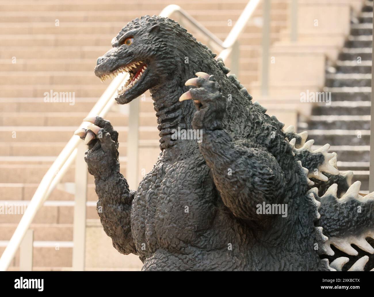 Tokyo, Japan. 22nd July, 2024. Movie star Godzilla joins "uchimizu ...
