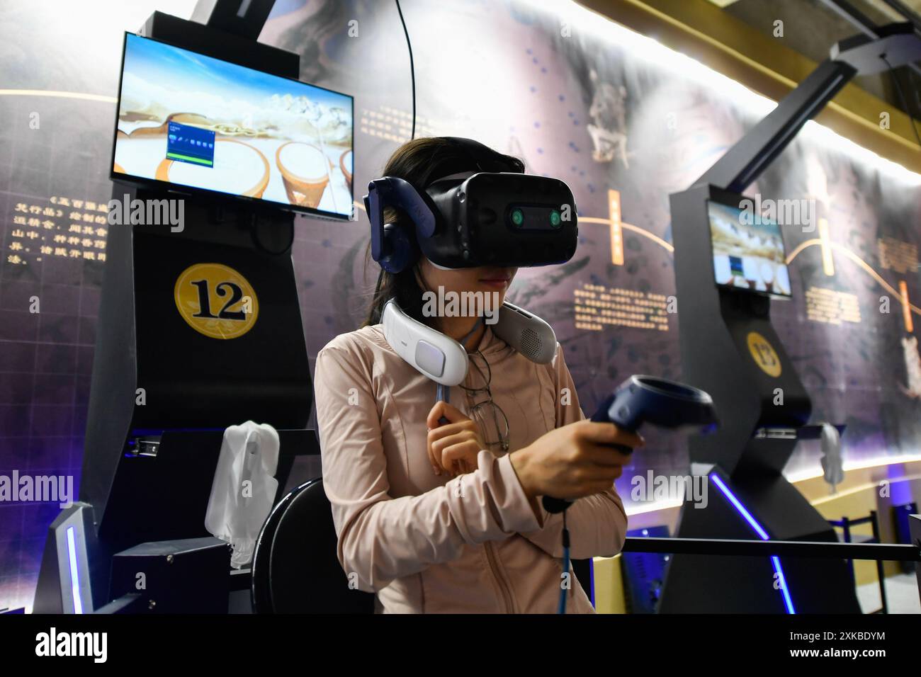 Dunhuang, China's Gansu Province. 22nd July, 2024. A visitor uses ...