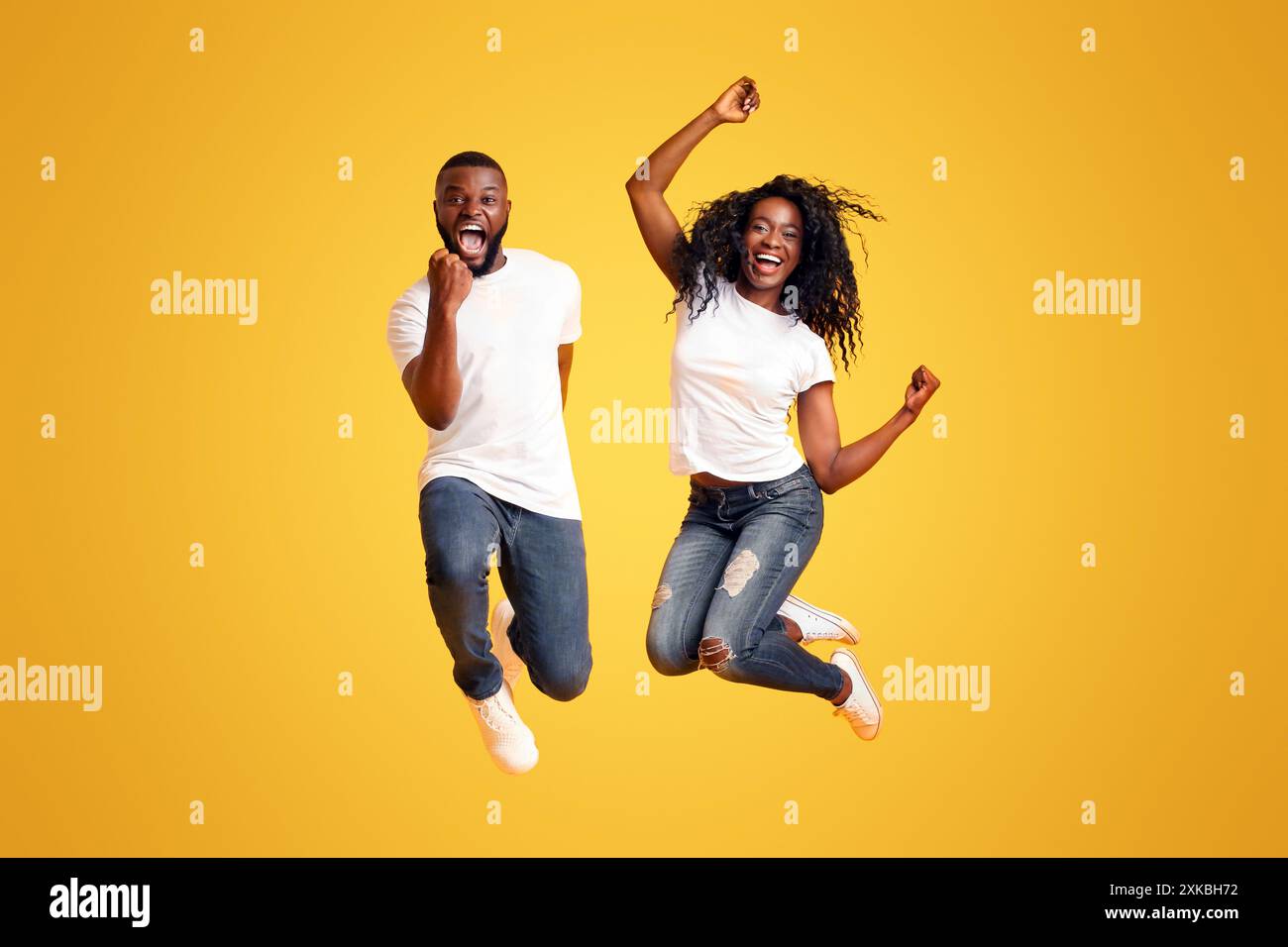 Black couple cheering jumping hi-res stock photography and images - Alamy
