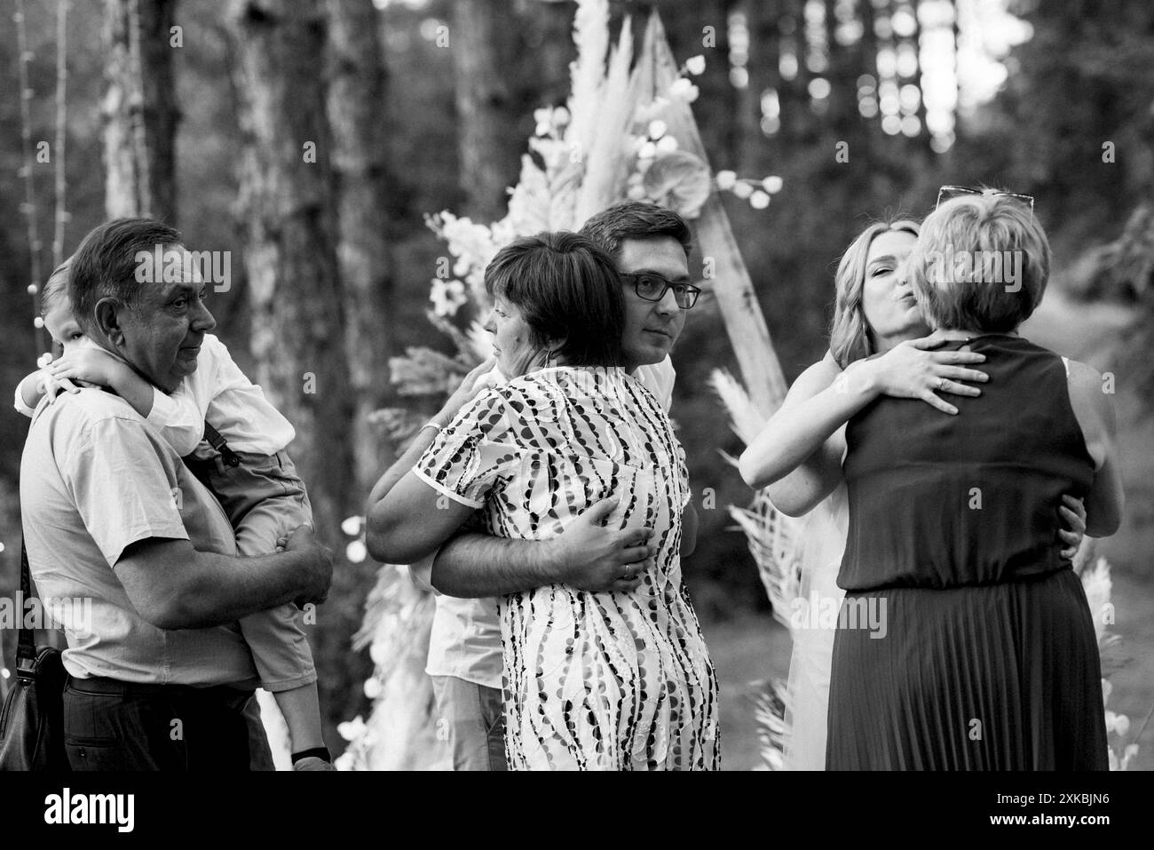 wedding congratulations of friends and guests with smiles and hugs of ...