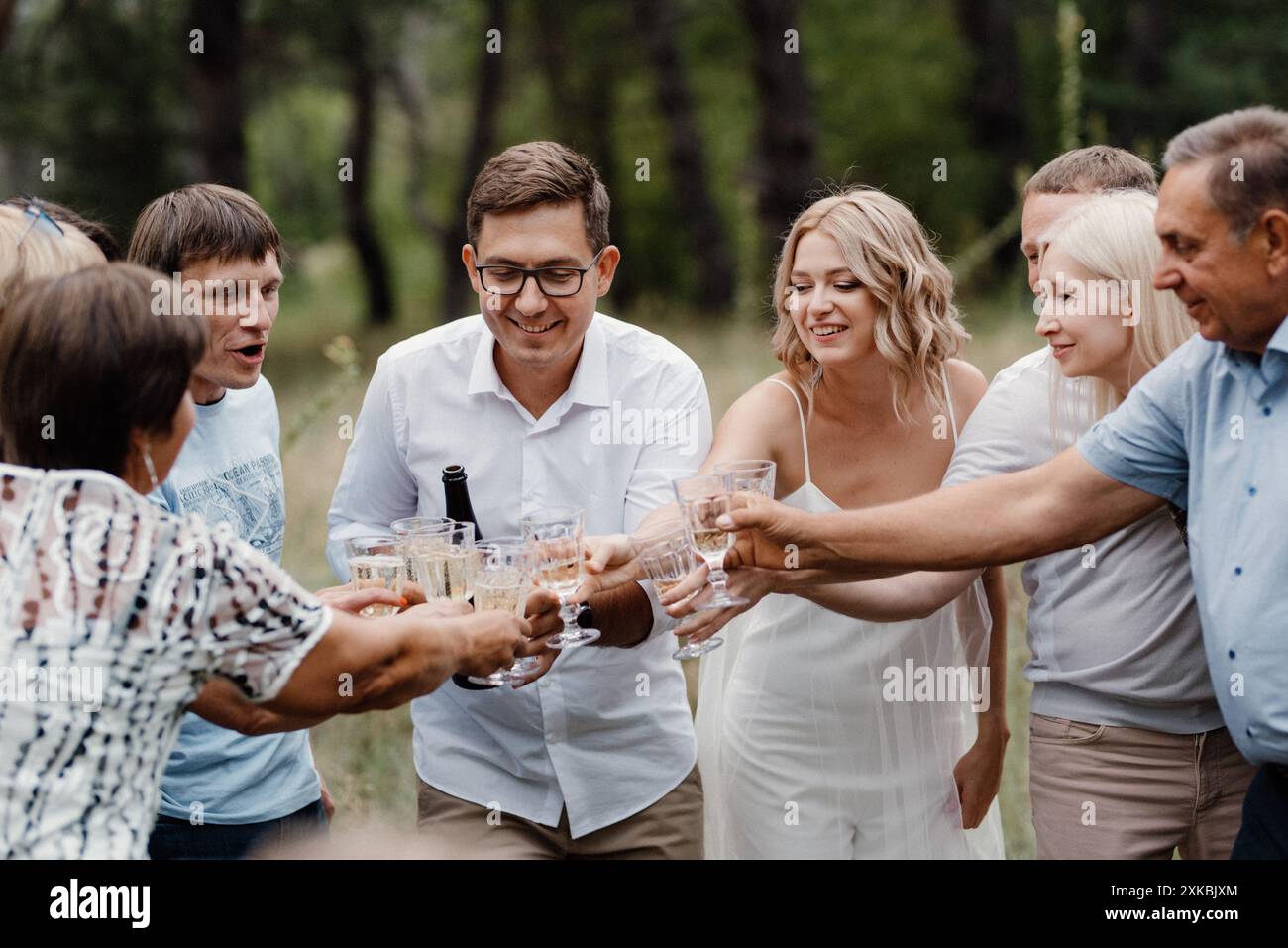 wedding congratulations of friends and guests with smiles and hugs of ...