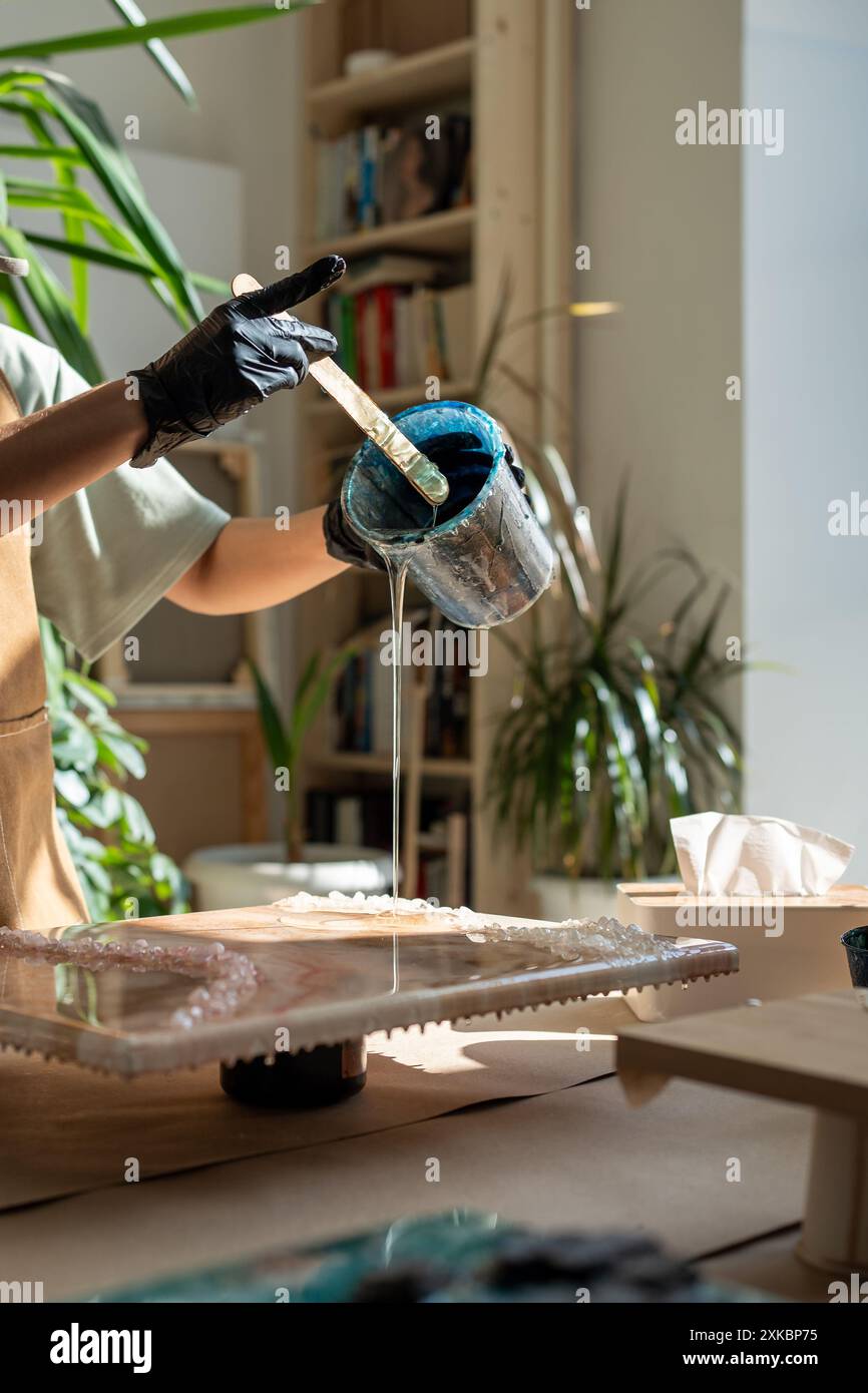 Artist working with liquid epoxy resin hi-res stock photography and ...