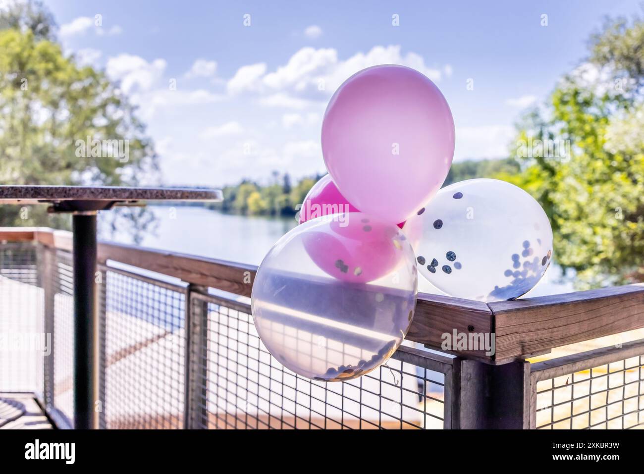 Decorative balloons on a reiling at a wedding Stock Photo - Alamy