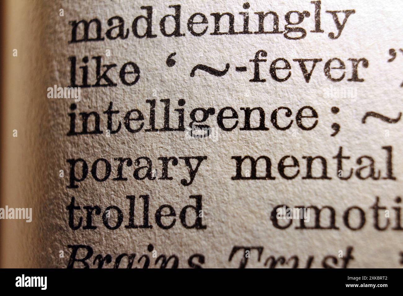 Word intelligence on dictionary page, macro close-up Stock Photo - Alamy