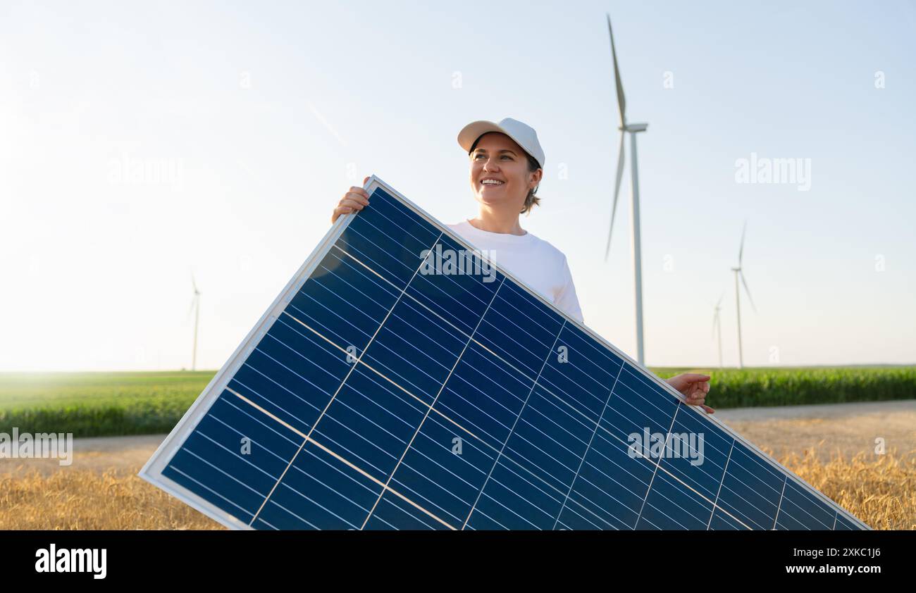 Female farmer wearing white cap with solar panel Stock Photo - Alamy