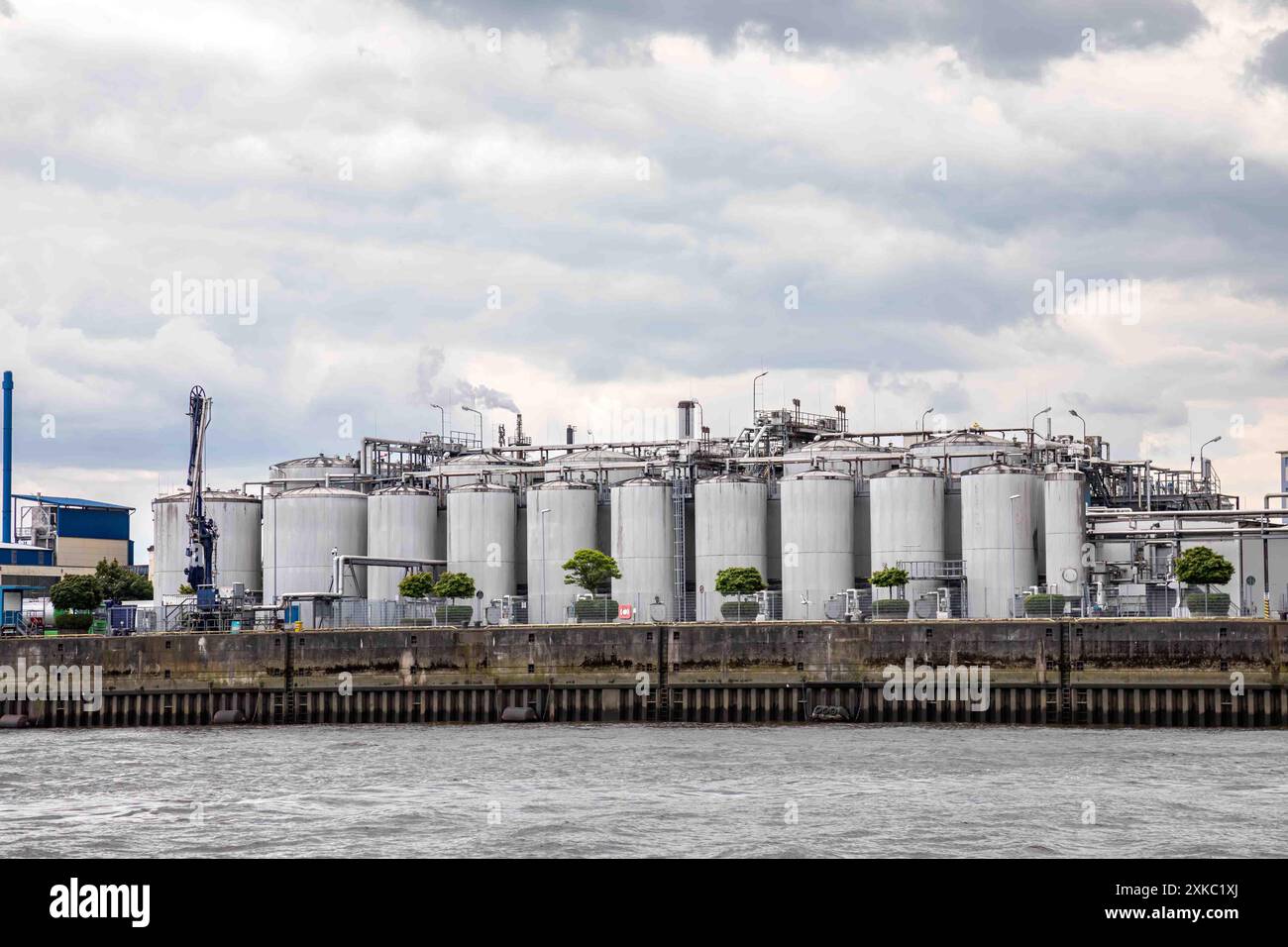 Hyrax chemical plant with industrial storage tanks on the bank of River ...