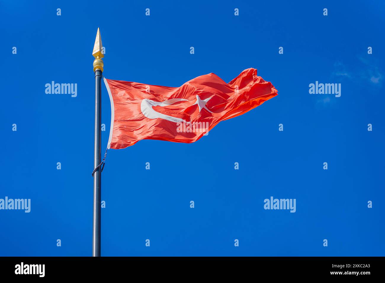 Turkish Flag Waving in the Wind Against Clear Blue Sky Stock Photo - Alamy
