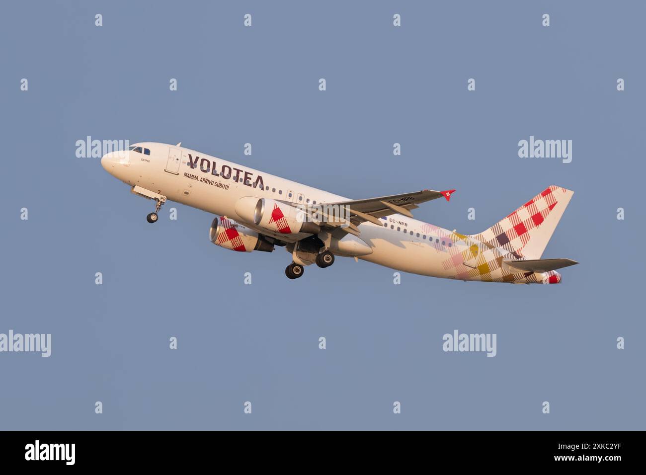 A Volotea Airbus A319 plane is seen taking off into a cloudless sky ...