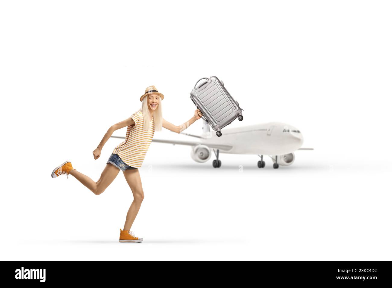 Happy female tourist running with a suitcase at the airport isolated on ...