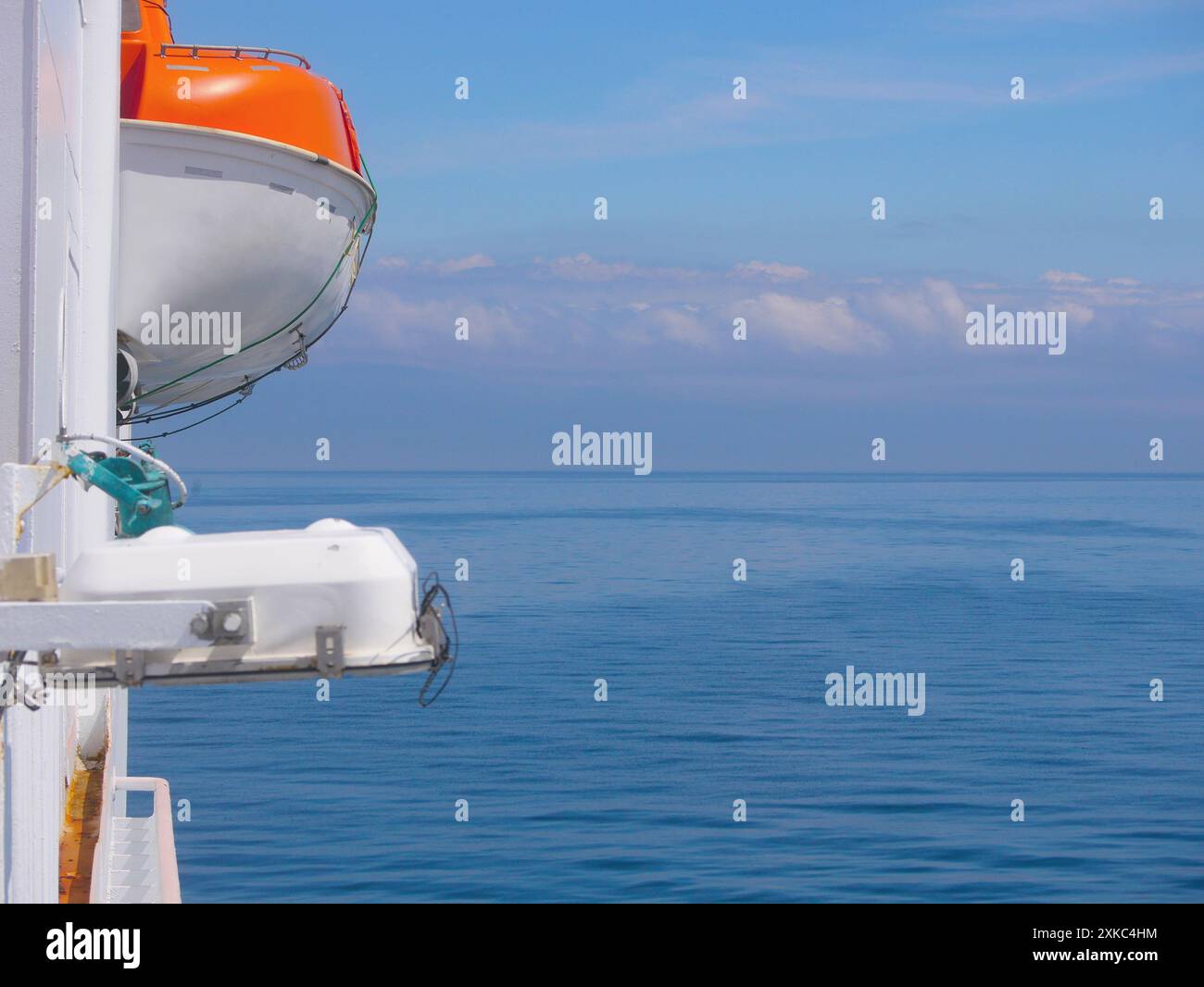 Lifeboat on the deck of a ferry cruise ship. Saving lives on the water ...