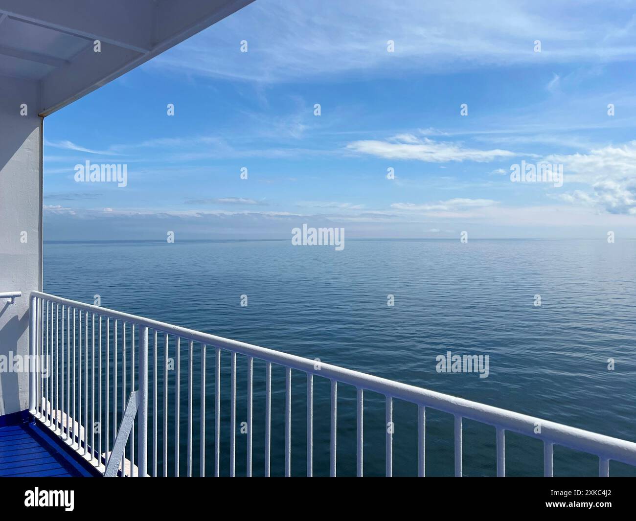 Sea view from the deck of a cruise ferry ship. Calm water without waves ...