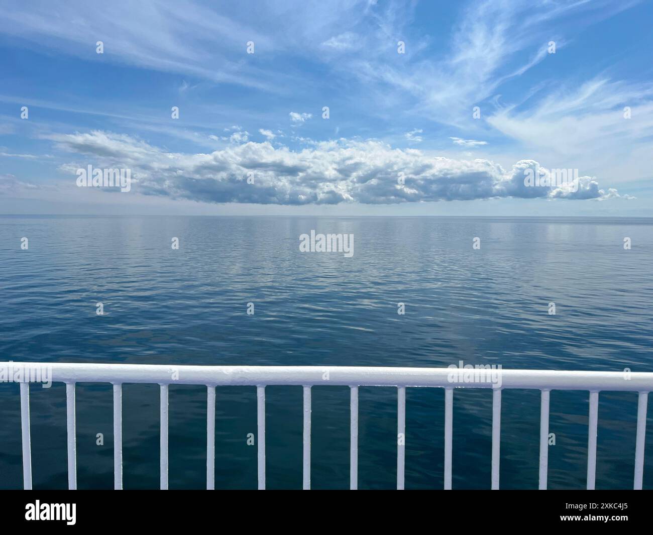 Sea view from the deck of a cruise ferry ship. Calm water without waves ...