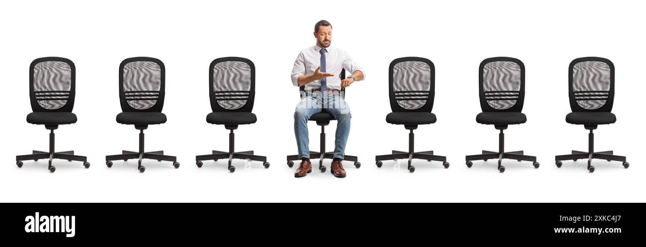 Man sitting in an office chair and checking time on watch isolated on ...