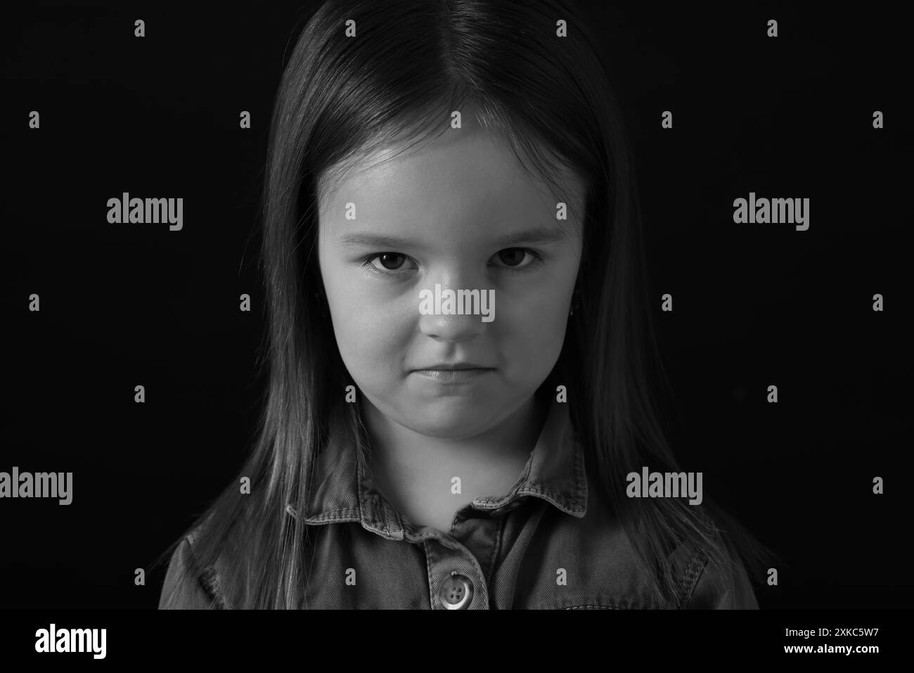 Portrait of sad girl on dark background, closeup. Black and white ...