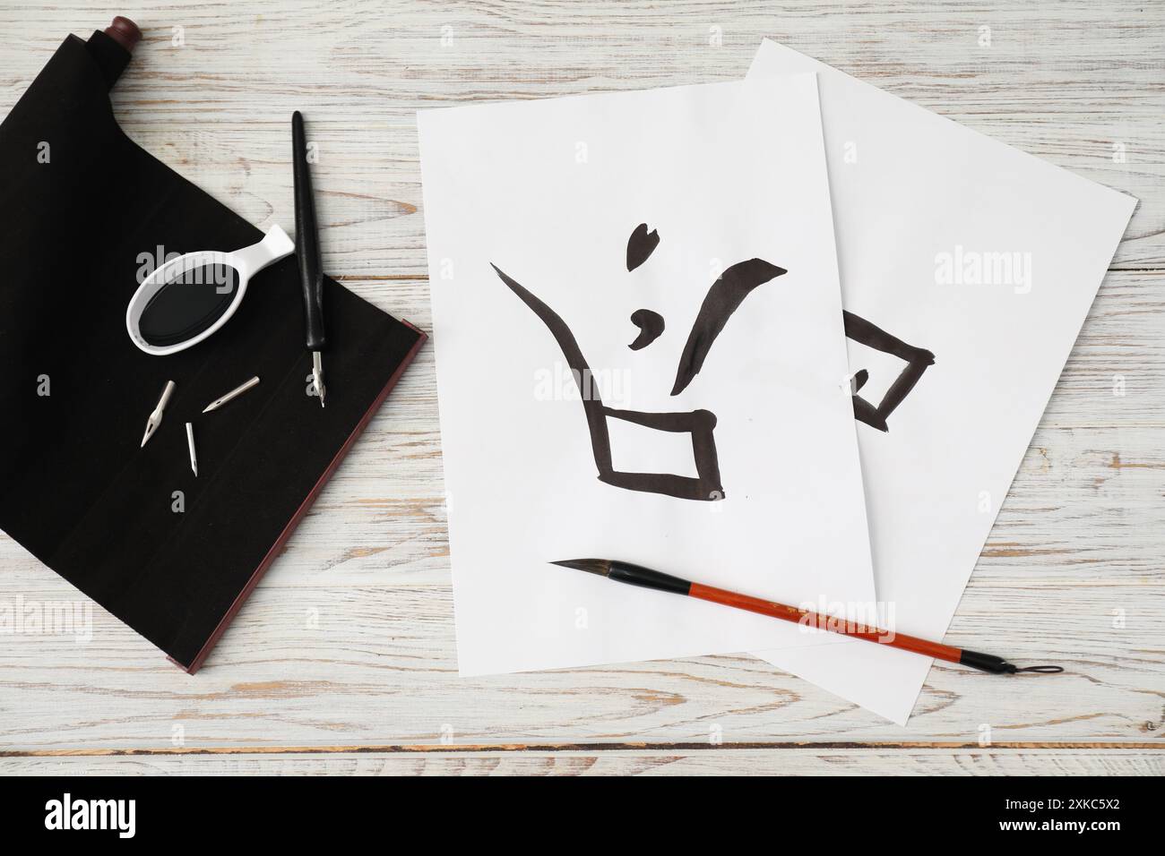 Calligraphy. Papers with written word Finish in Chinese, inkwell ...