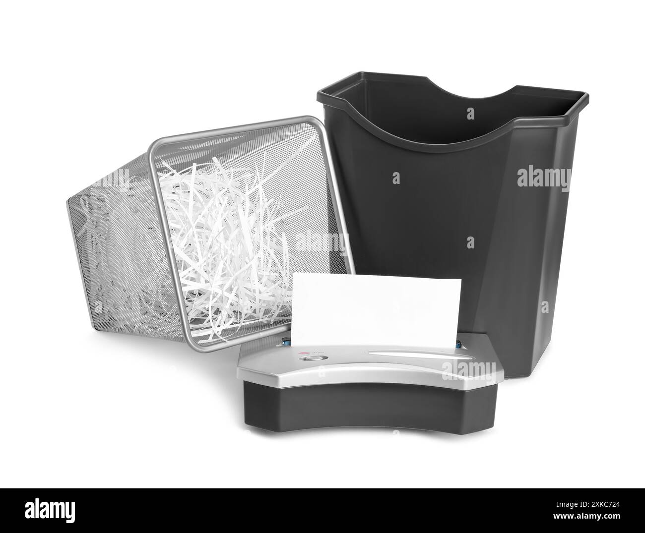 Shredder, metal basket and paper strips on white background Stock Photo ...
