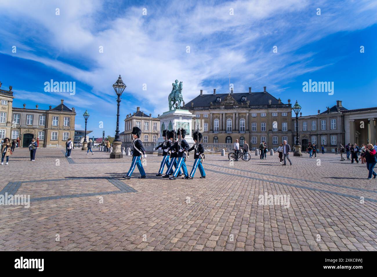 Copenhagen, Denmark - April 28, 2024: The Royal Guards march in formation during the Changing of ...