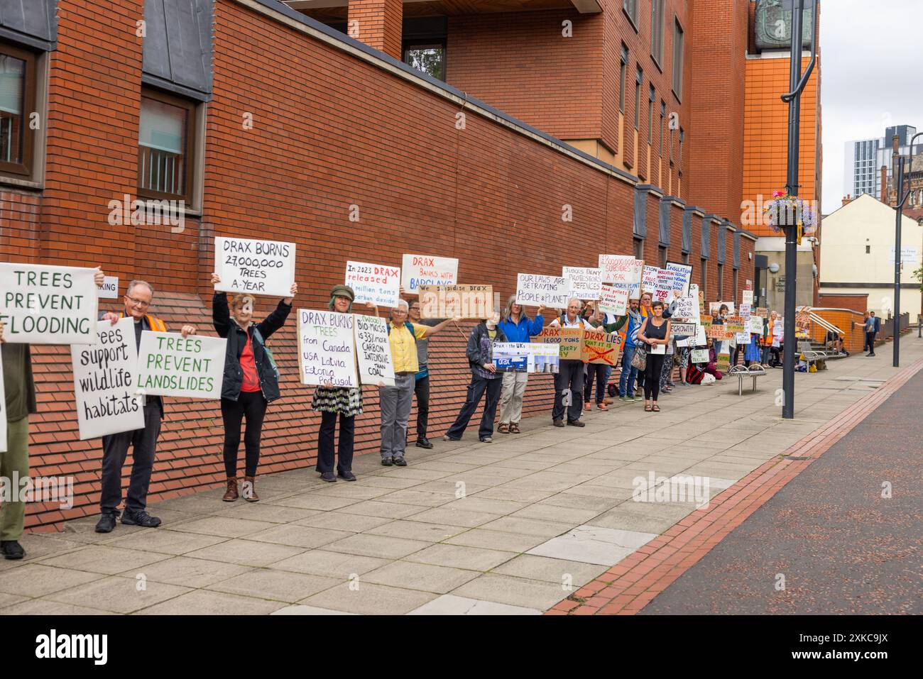 Leeds, UK. 22 JUL, 2024. Multiple activists stand with placards outside ...