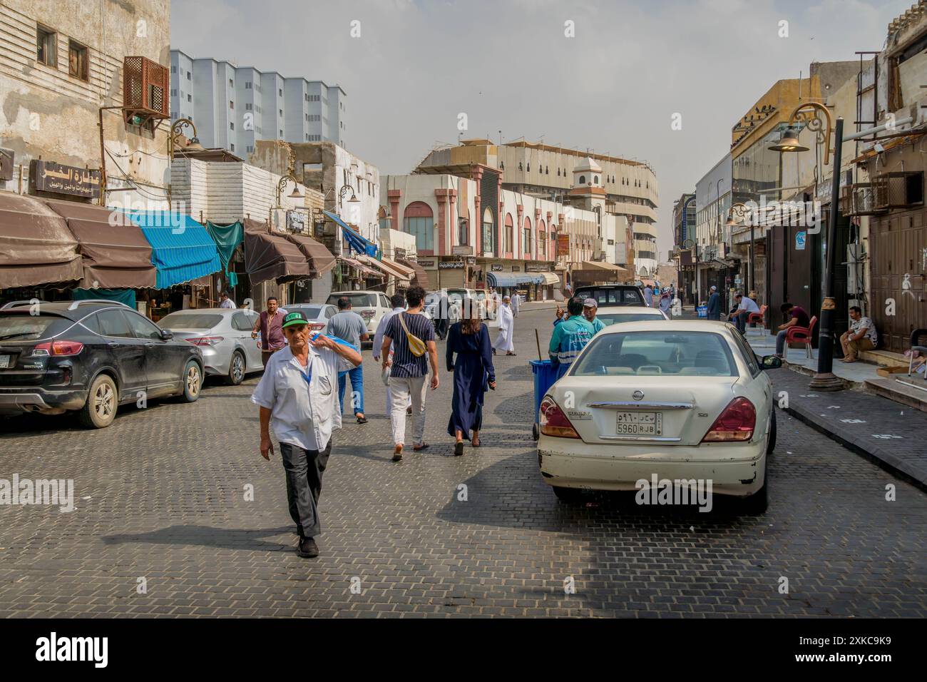 Saudi people on the streets of historic Jeddah (Al Balad), with the ...