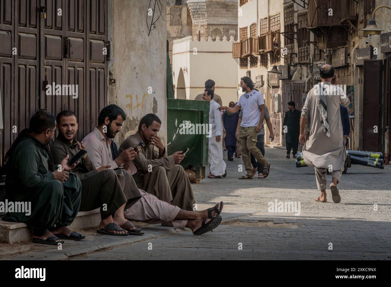 The local Arab men sitting on the porch of the old Saudi building in ...