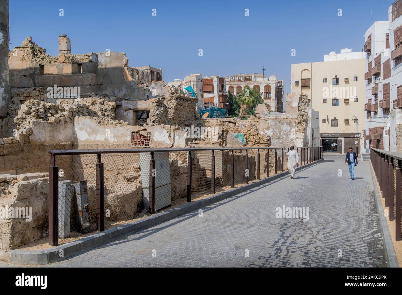 Local people are walking by the historic archeological site of historic ...