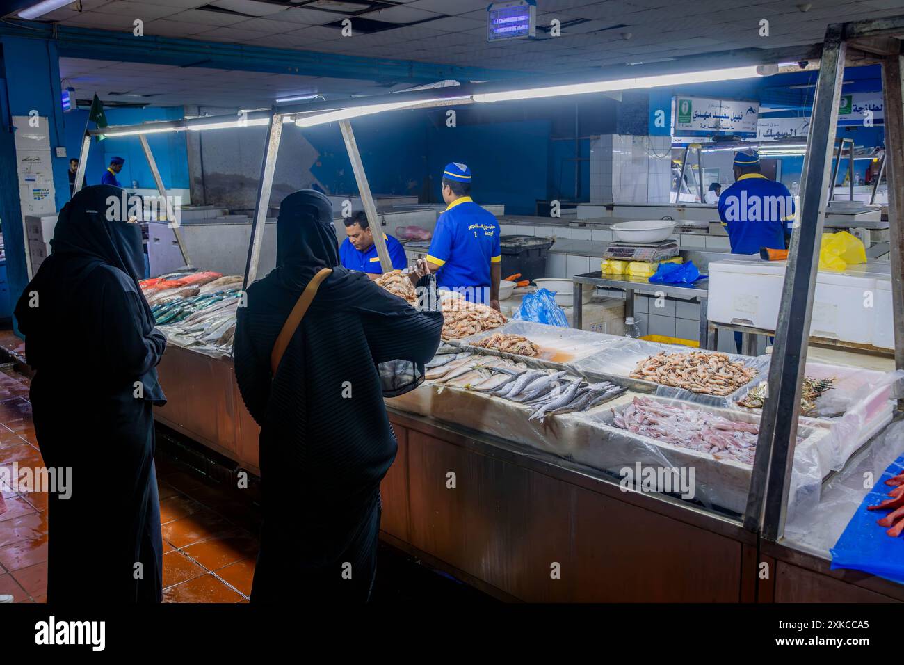 The Arab women covered in paranja at the Jeddah fish market at seafood ...