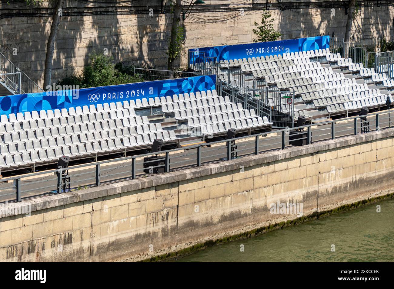 Rows of seats in the stands built on the banks of the Seine river for ...