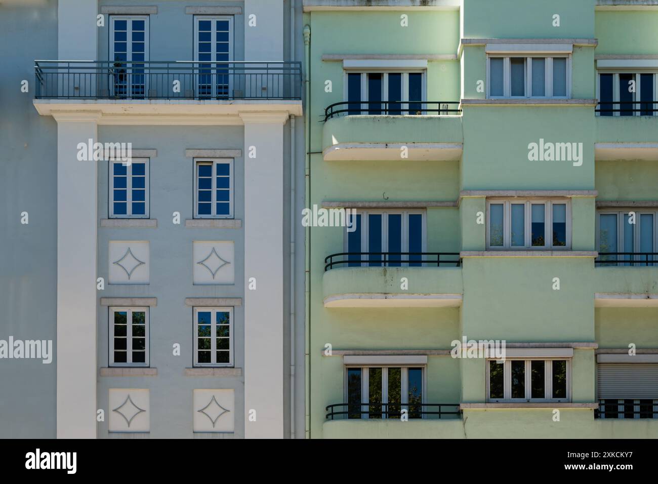 2 classic apartment building facades with contrasting colours and ...