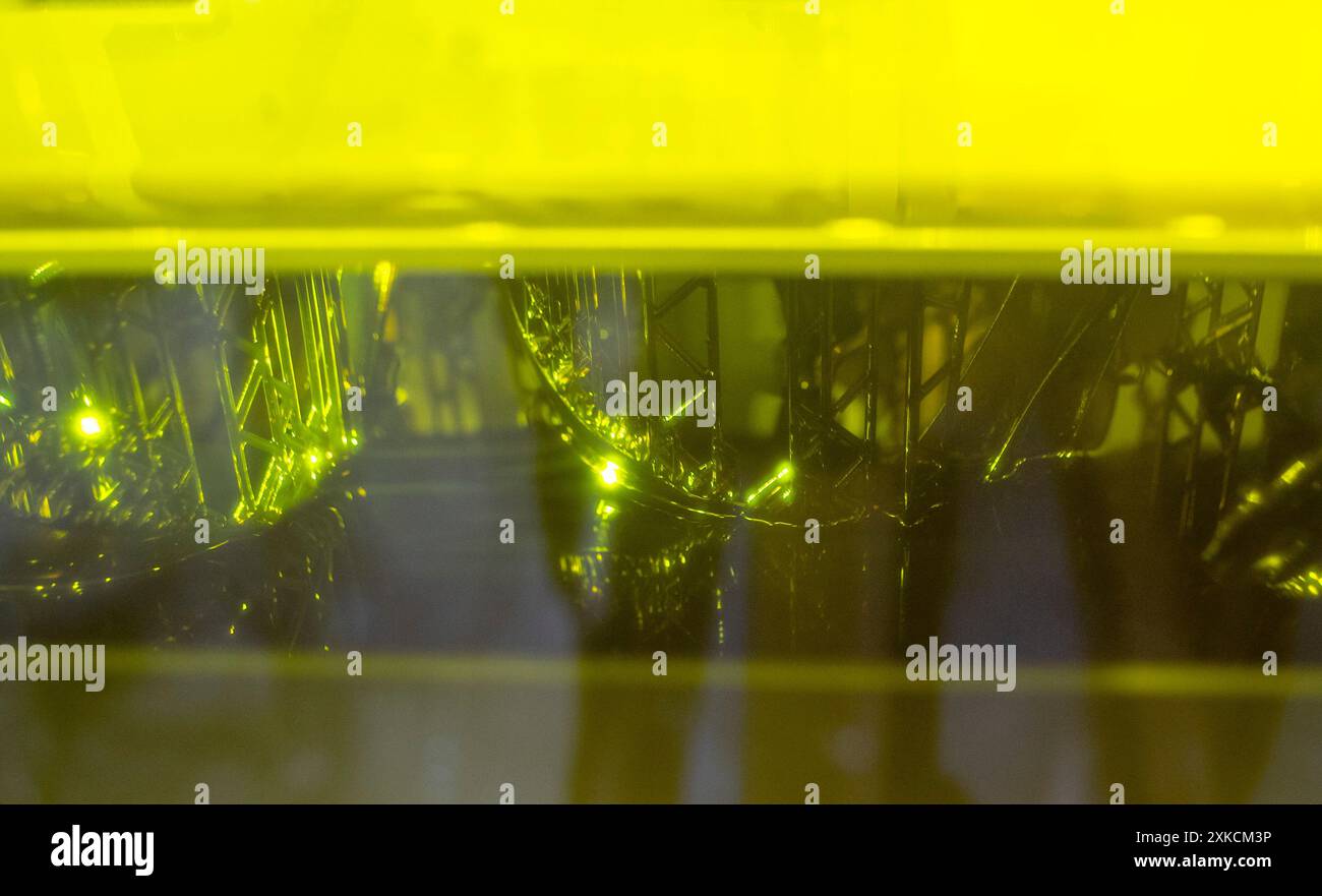 Working of photopolymer sla 3D printer. Platform with building object ...