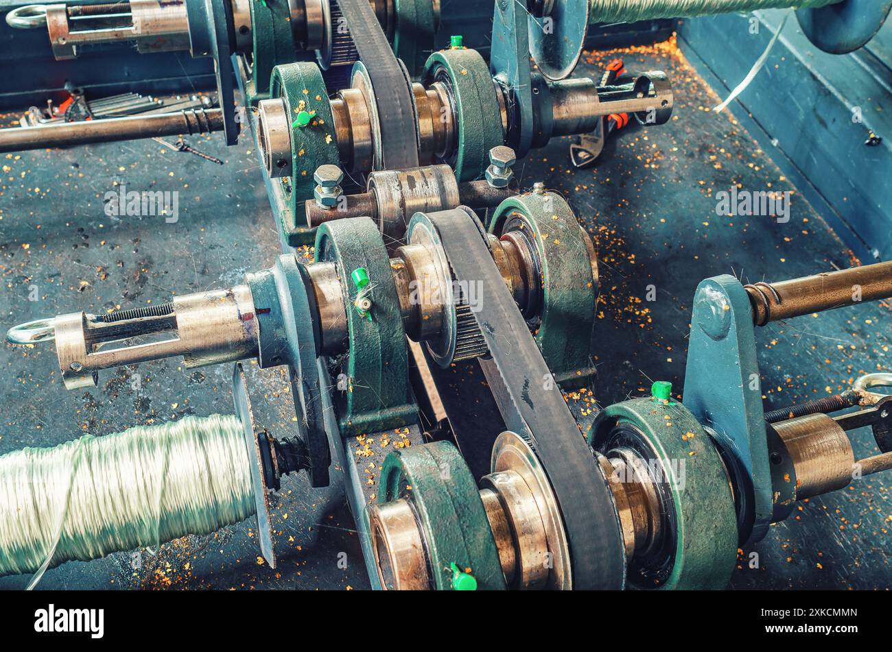 Close up industrial machine with metal shafts and plates. Coils for ...