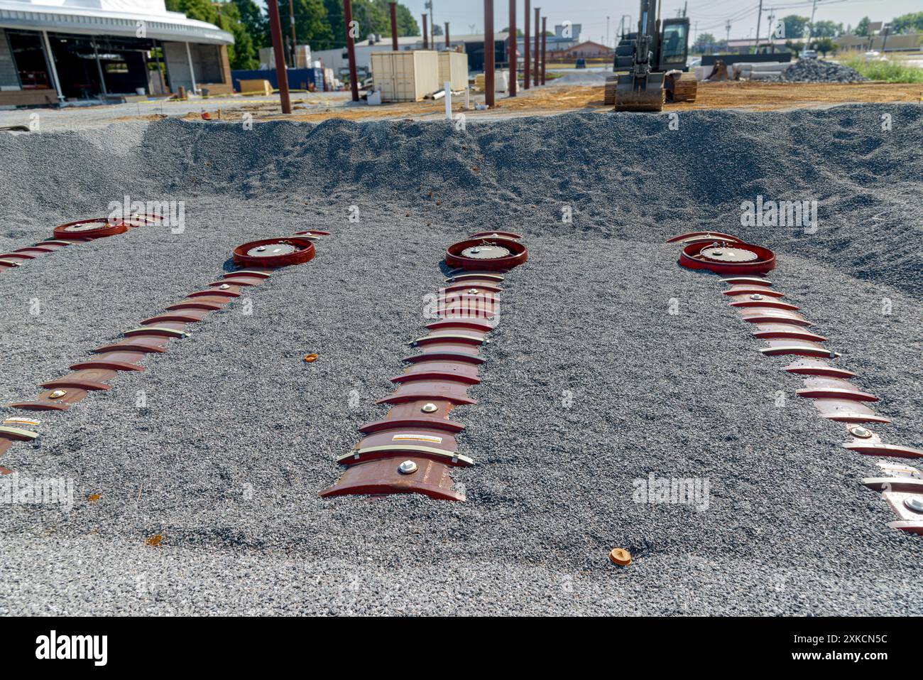 Horizontal close-up shot of four underground fuel storage tanks at new ...
