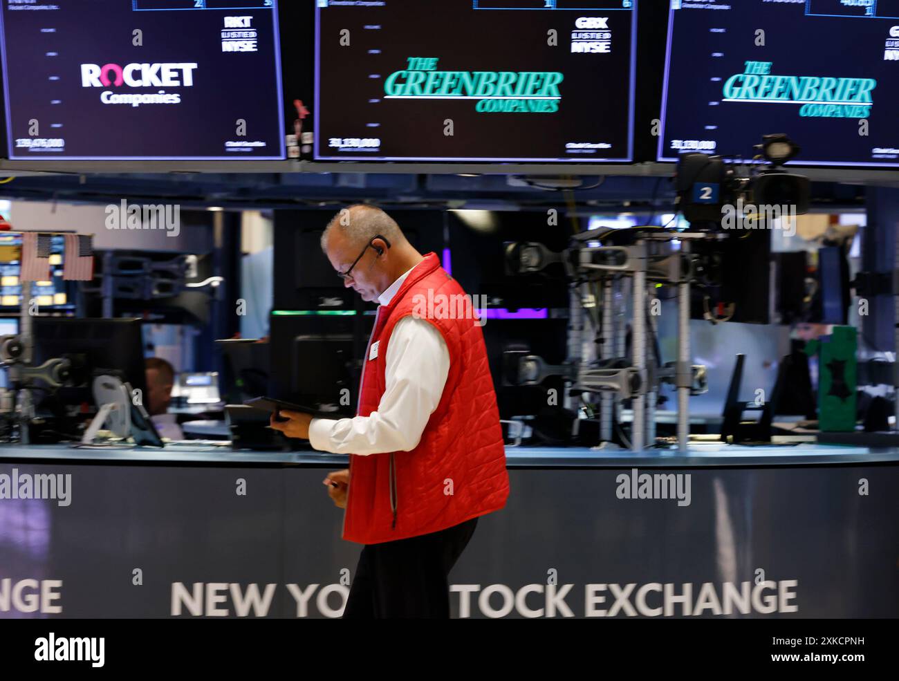 New York, United States. 22nd July, 2024. Traders work on the floor of ...