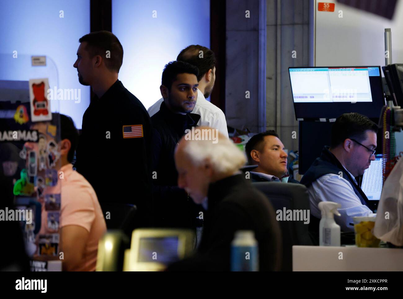 New York, United States. 22nd July, 2024. Traders work on the floor of ...