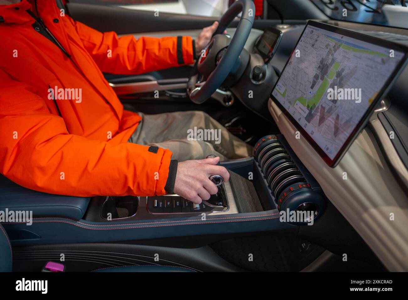 man in car driving BYD ATTO 3 Car Electric Car, male hand on center ...