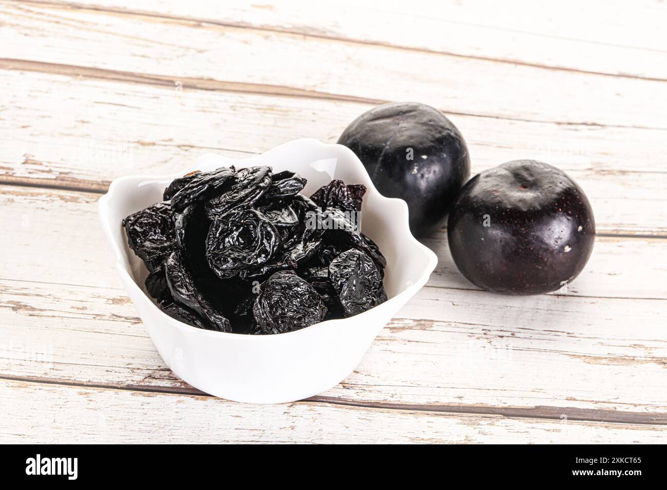Dry sweet prunes in thw bowl Stock Photo - Alamy