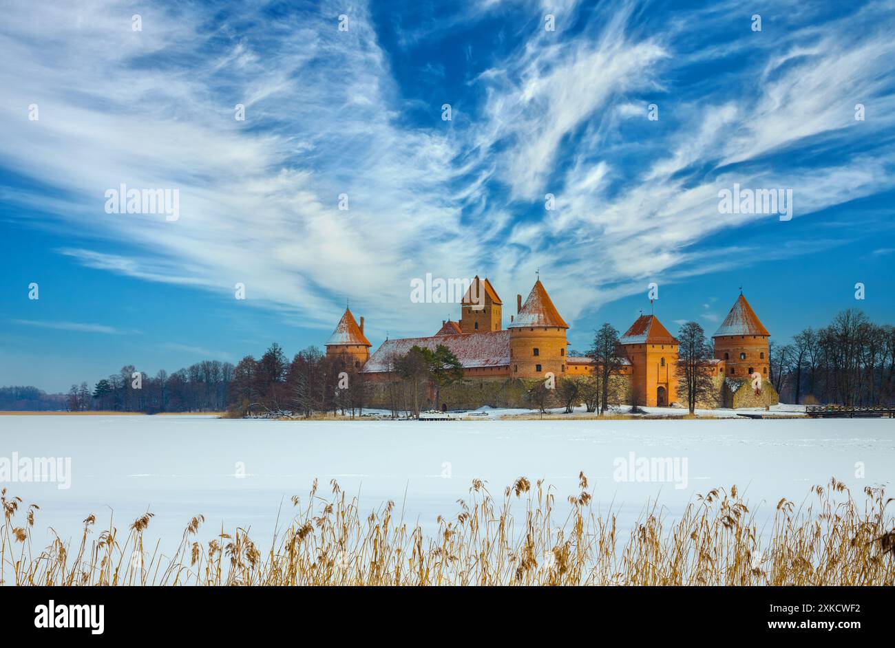Frozen lake with ancient Trakai castle on background in winter Stock ...