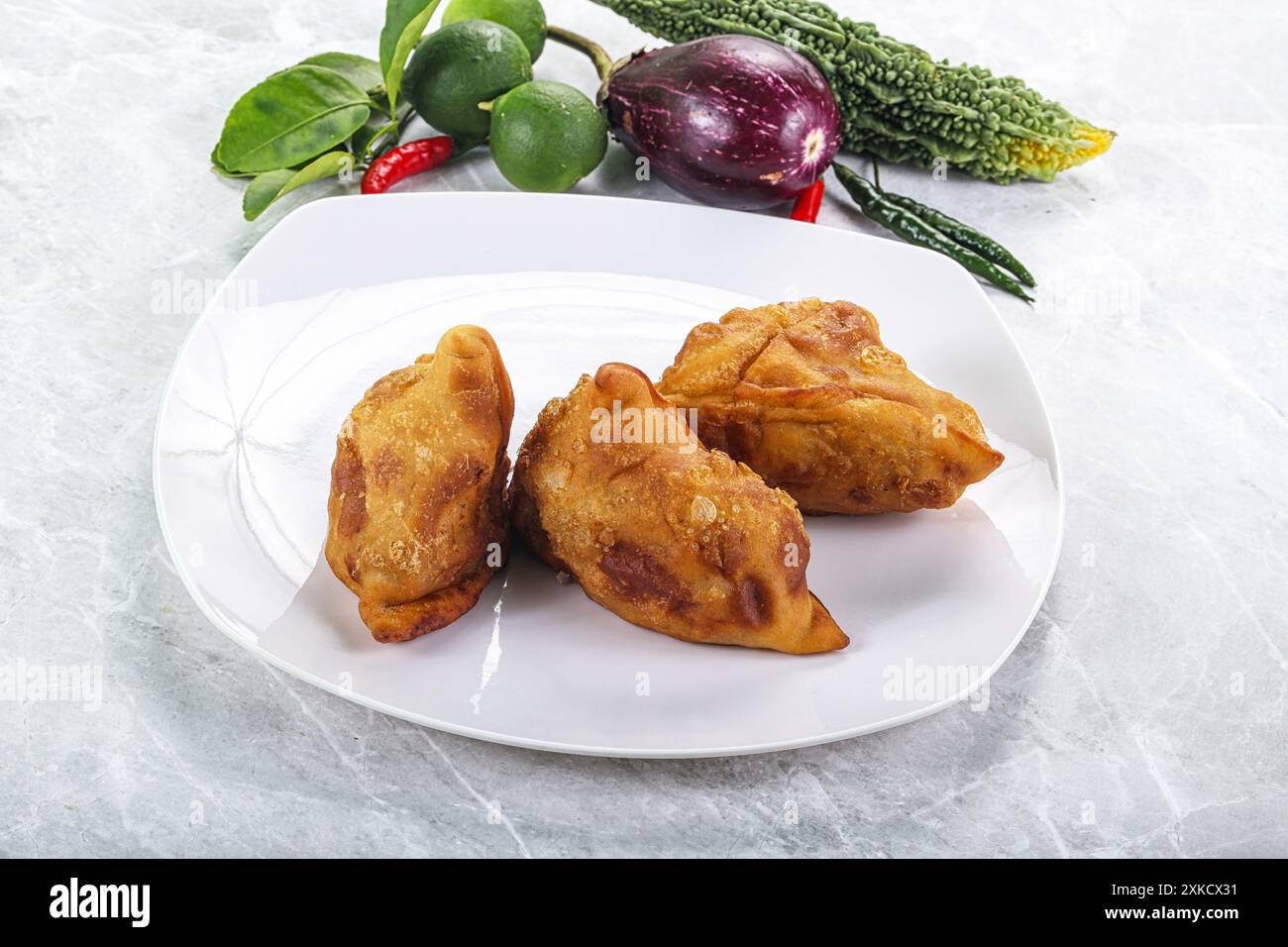 Indian cuisine - fries crispy stuffed samosa Stock Photo - Alamy