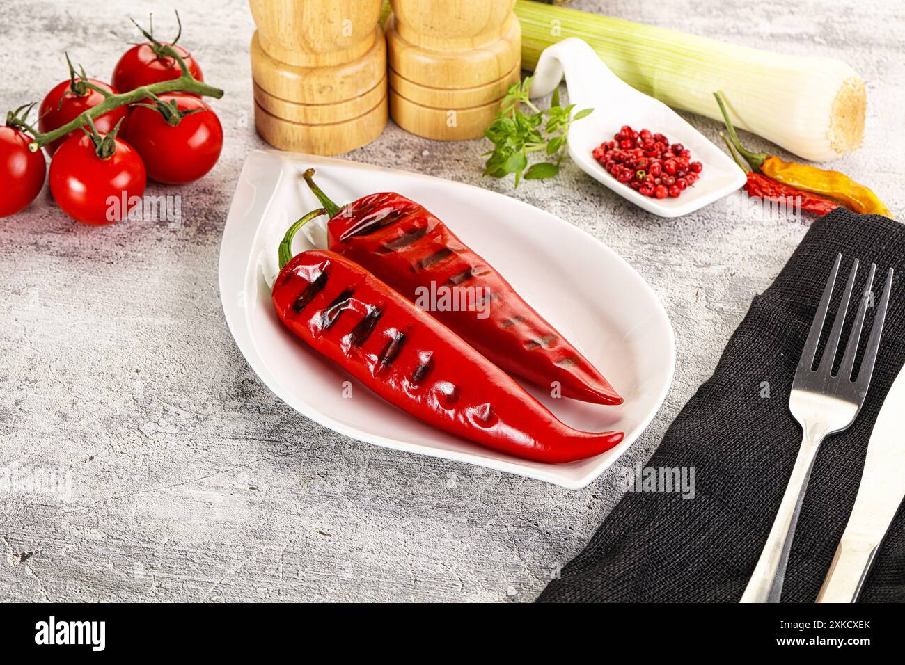 Grilled red spicy pepper snack in the bowl Stock Photo - Alamy